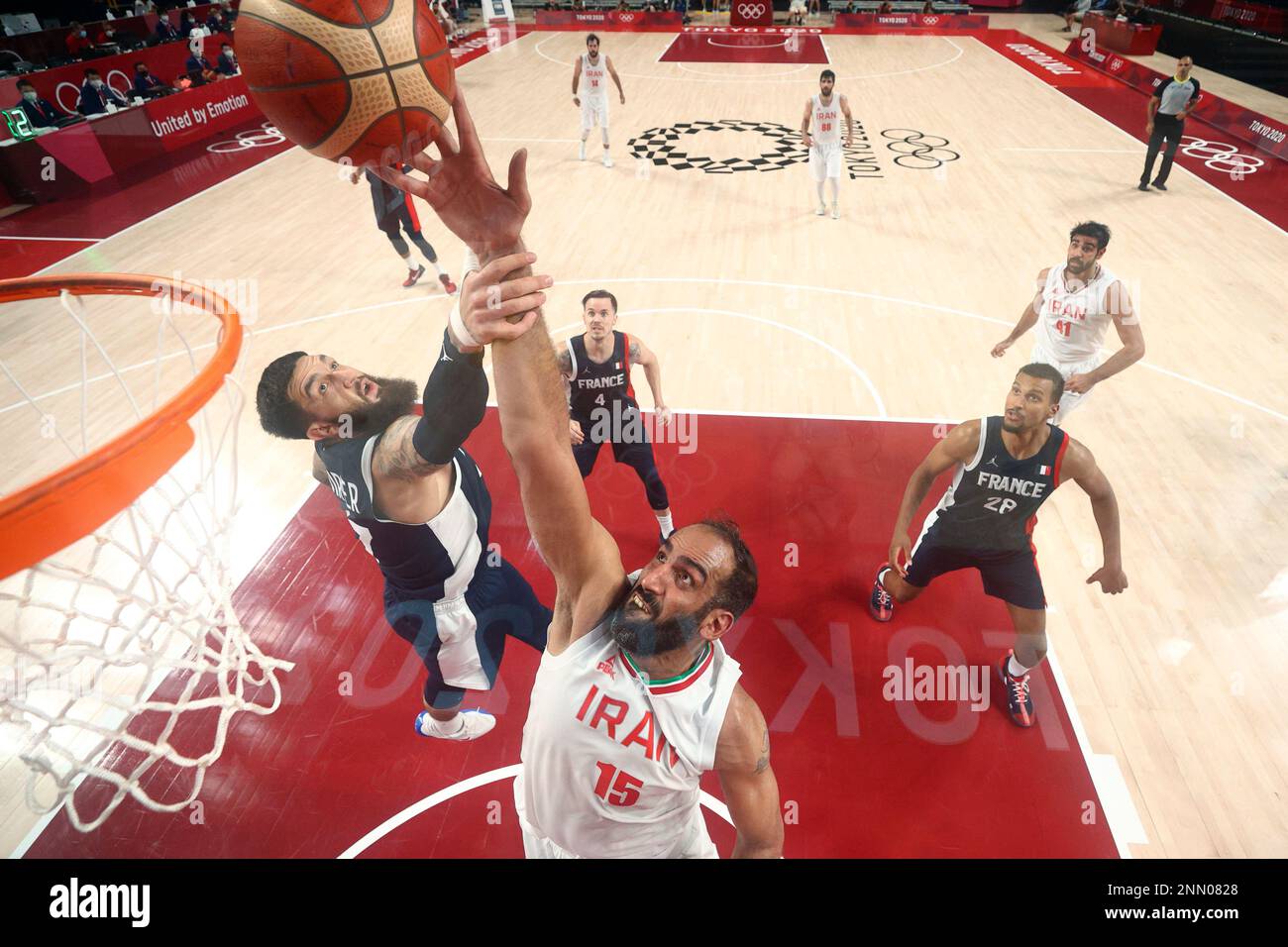 Iran's Hamed Haddadi (15) is fouled by France's Vincent Poirier (17 ...