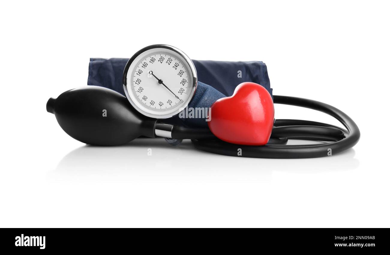 Blood pressure meter and toy heart on white background Stock Photo - Alamy