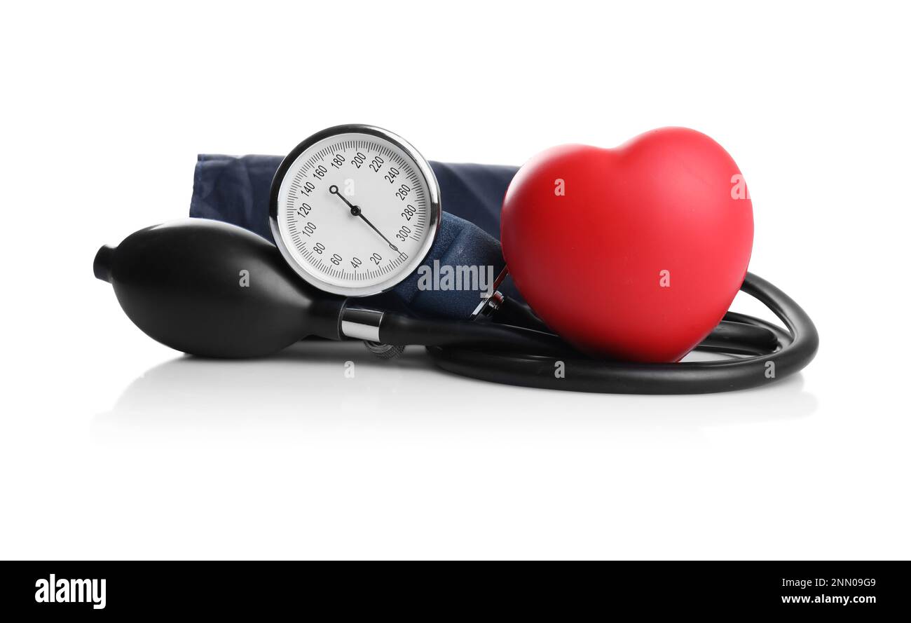Blood pressure meter and toy heart on white background Stock Photo - Alamy