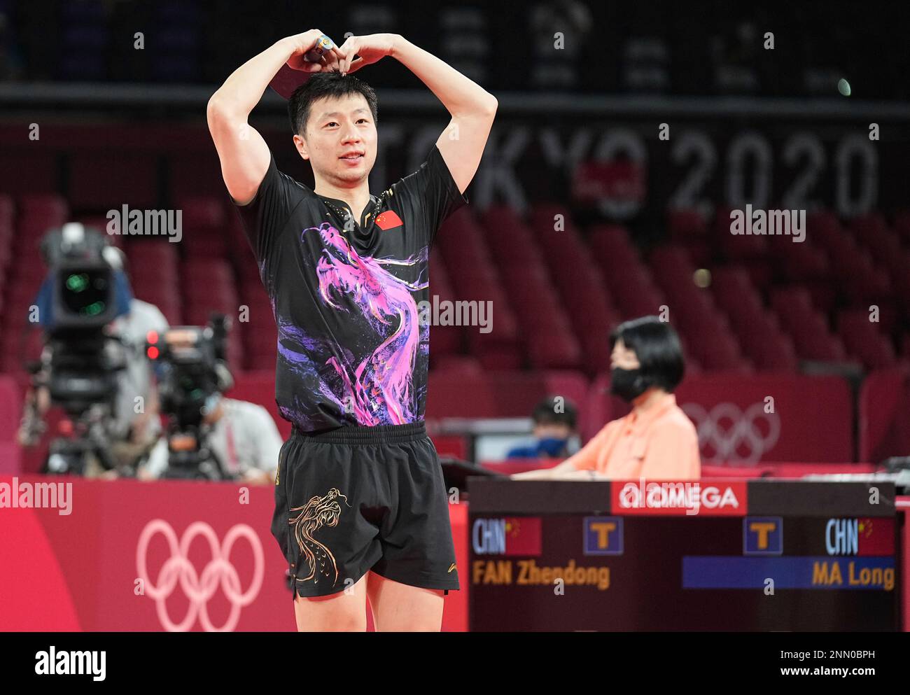China's MA Long reacts during the Final Match against FAN Zhendong at ...