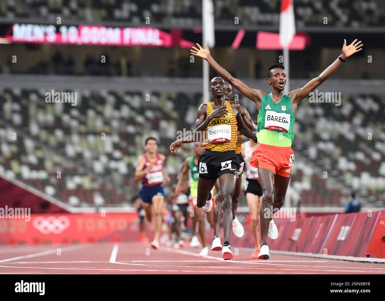 Ethiopia's BAREGA Selemon (front) followed by Uganda's CHEPTEGEI Joshua ...