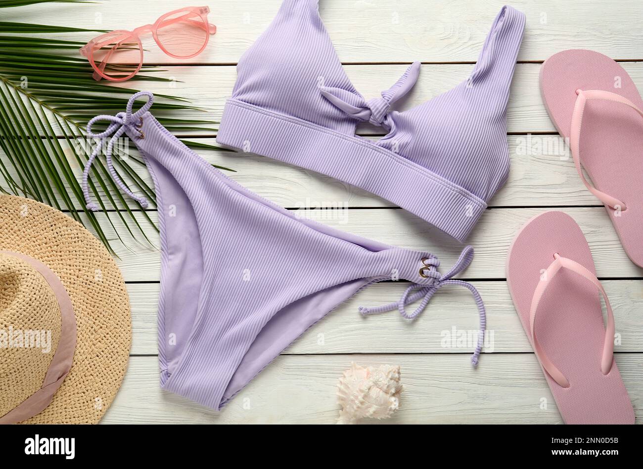 Flat lay composition with beach objects on white wooden background ...