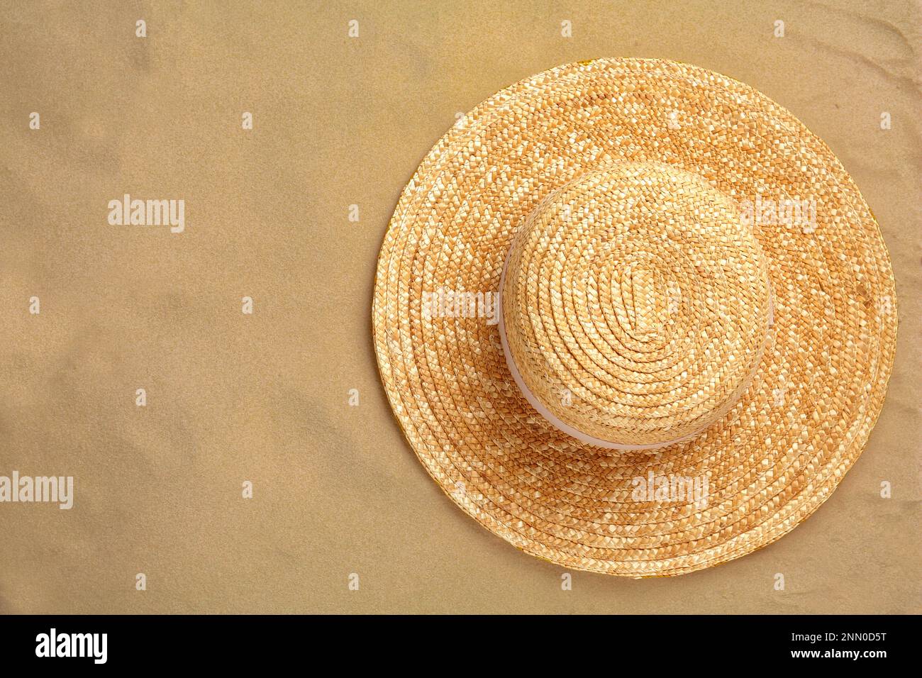 Stylish straw hat on sand, top view. Space for text Stock Photo - Alamy
