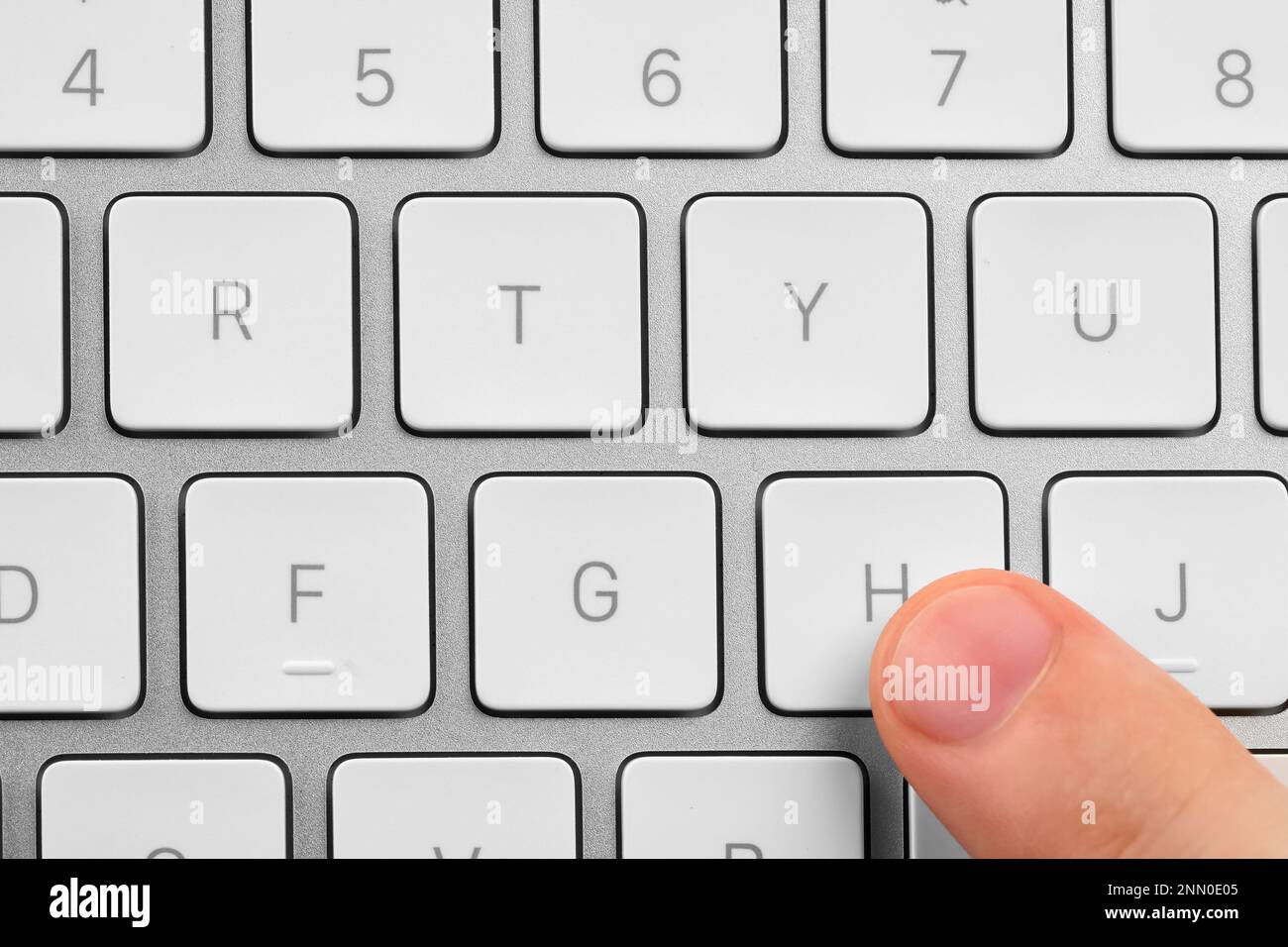 Top view of man pressing button on computer keyboard, closeup Stock Photo - Alamy