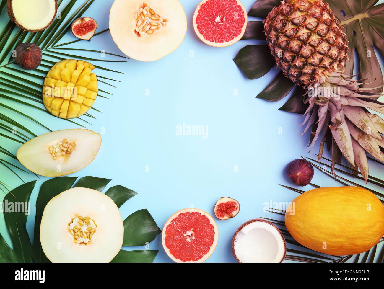 Frame made of melon with other fruits and space for text on color ...