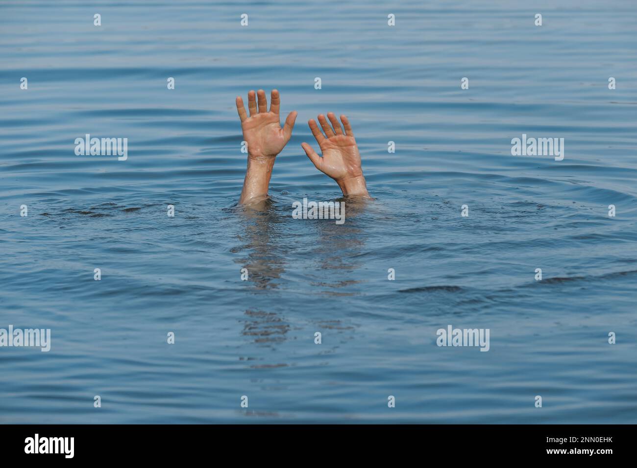 Drowning man reaching for help in sea, closeup Stock Photo - Alamy