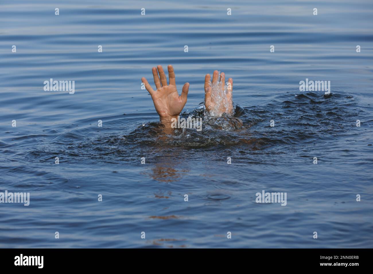 Drowning man reaching for help in sea, closeup Stock Photo - Alamy