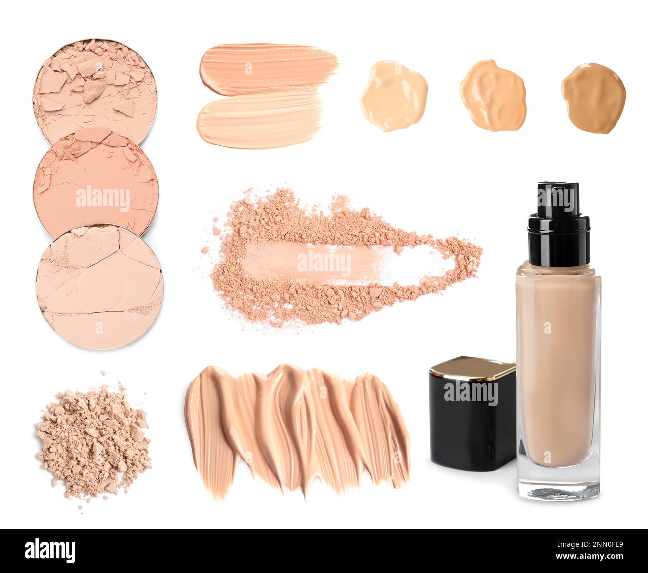 Set with different liquid foundation and face powder on white ...