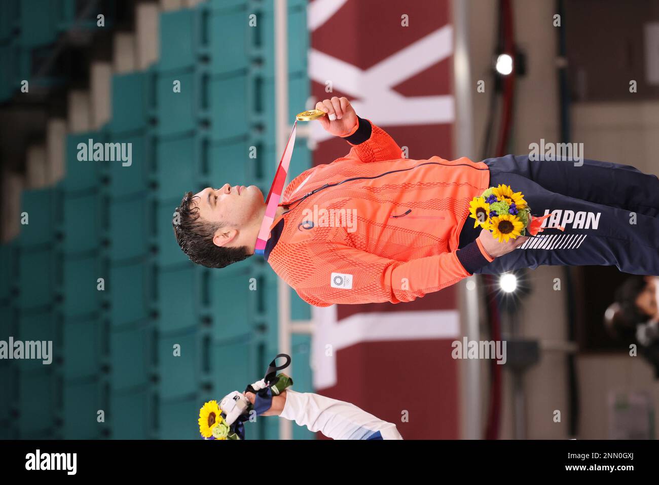 Japanese WOLF Aaron poses with the gold medal during the awarding ...