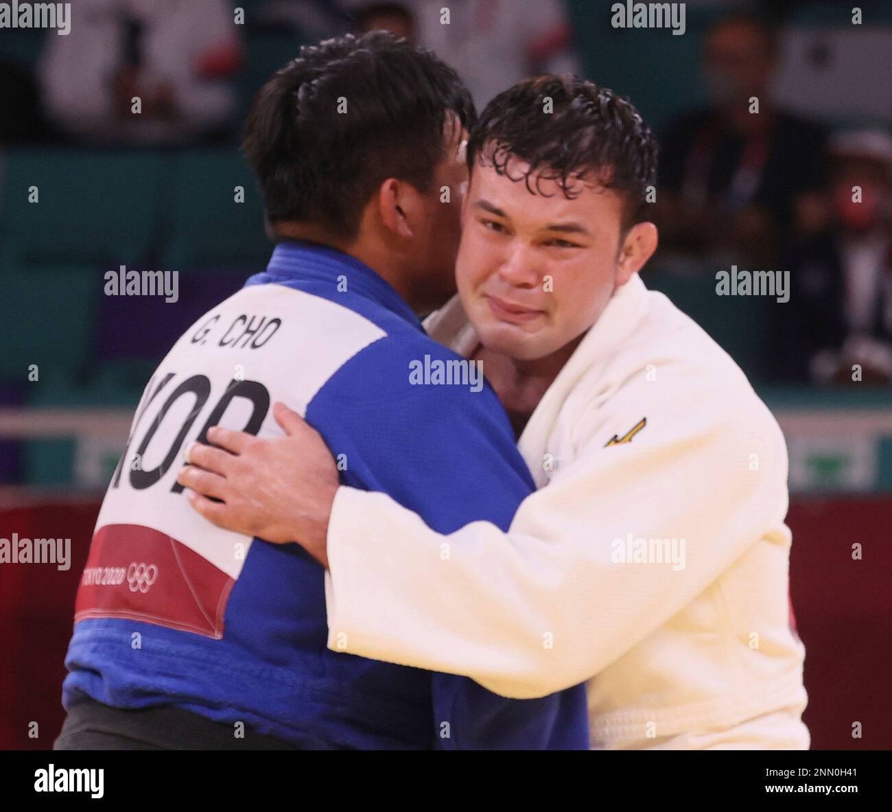 Japanese WOLF Aaron (L) hugs Korean CHO Guham during the Men-100kg Gold ...