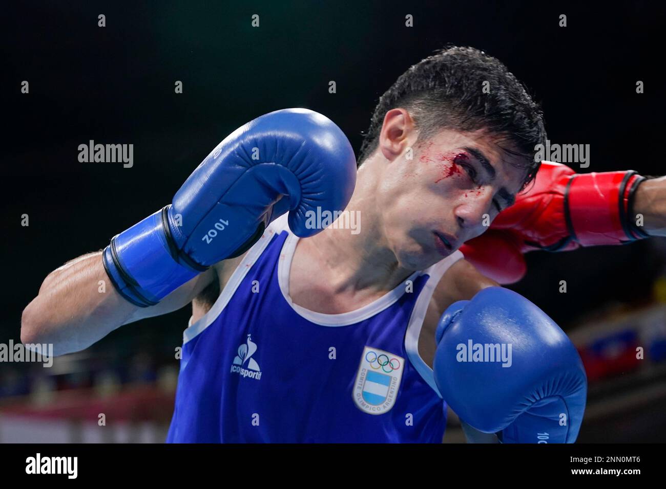 Argentina's Mirco Jehiel Cuello, left, slips a punch by Thailand's ...