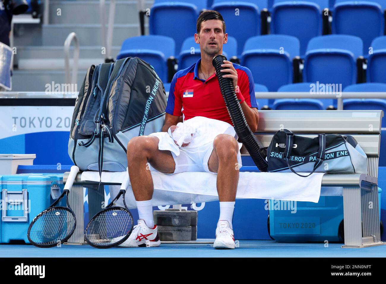 TOKYO, JAPAN - JULY 28: Novak Djokovic tries to keep cool in the ...