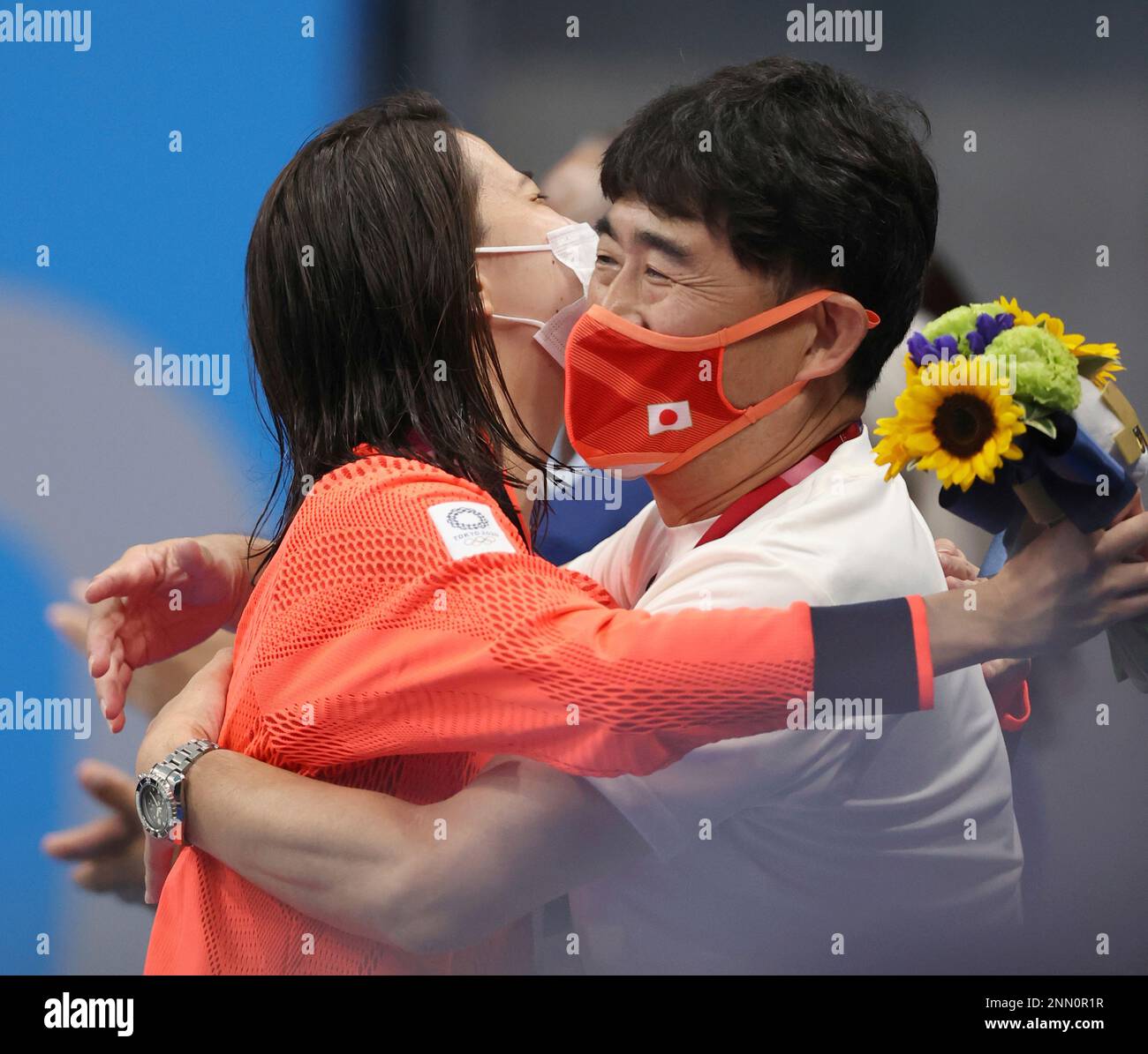 Japan's Yui Ohashi hugs Norimasa Hirai, a head coach of Japan after the ...
