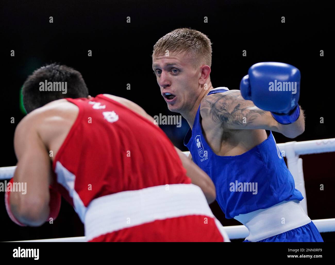 Ireland's Kurt Anthony Walker competes with Uzbekistan's Mirazizbek ...