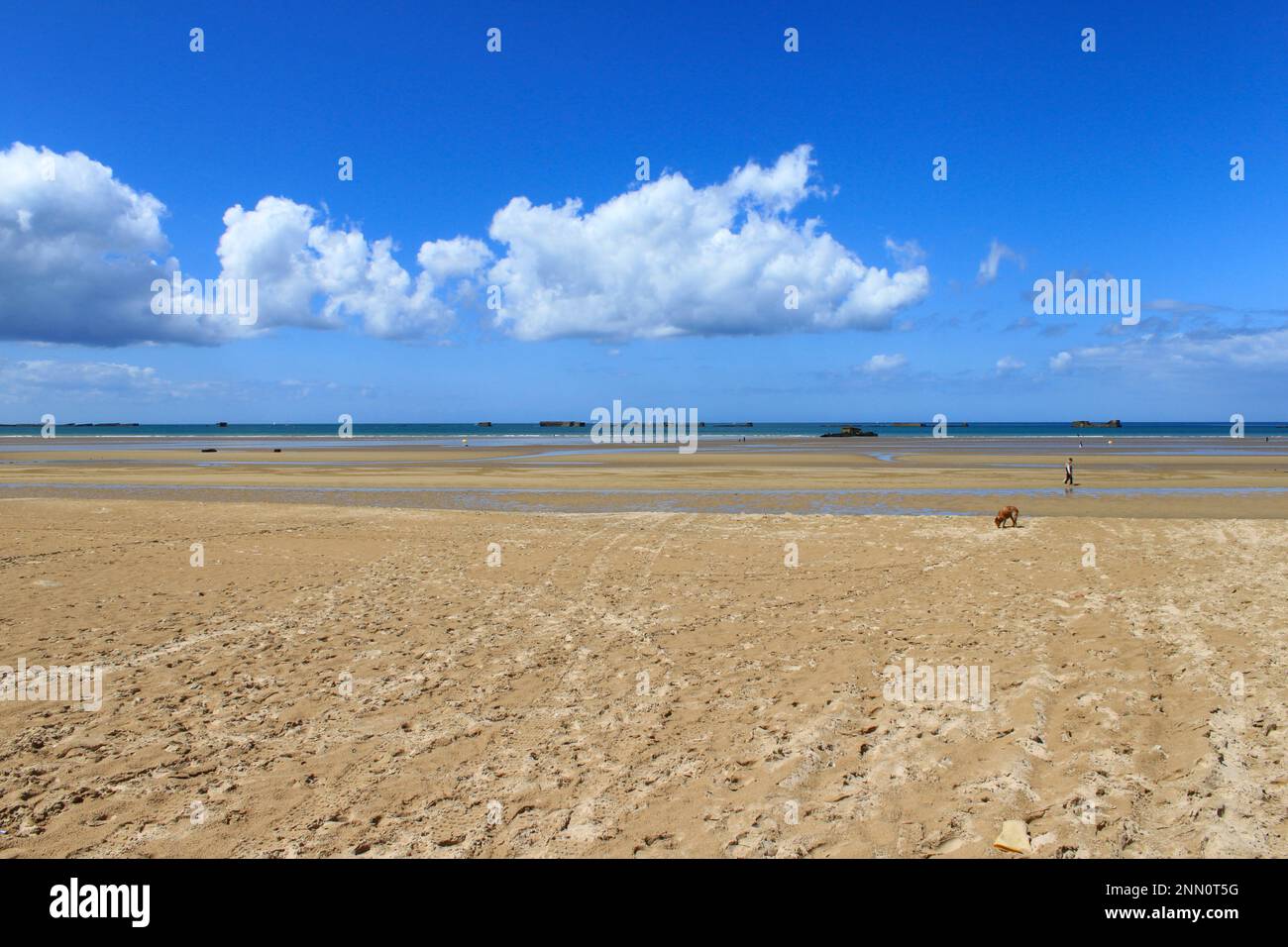 A landing beach in Normandy with the pontoon bridge from the Second ...