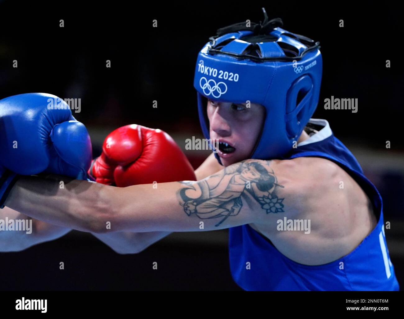 Italy's Irma Testa exchange punches with Canada's Caroline Veyre during ...