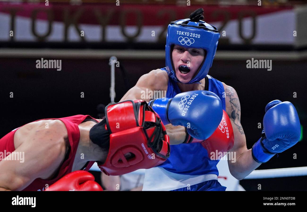 Italy's Irma Testa, in blue, exchange punches with Canada's Caroline ...