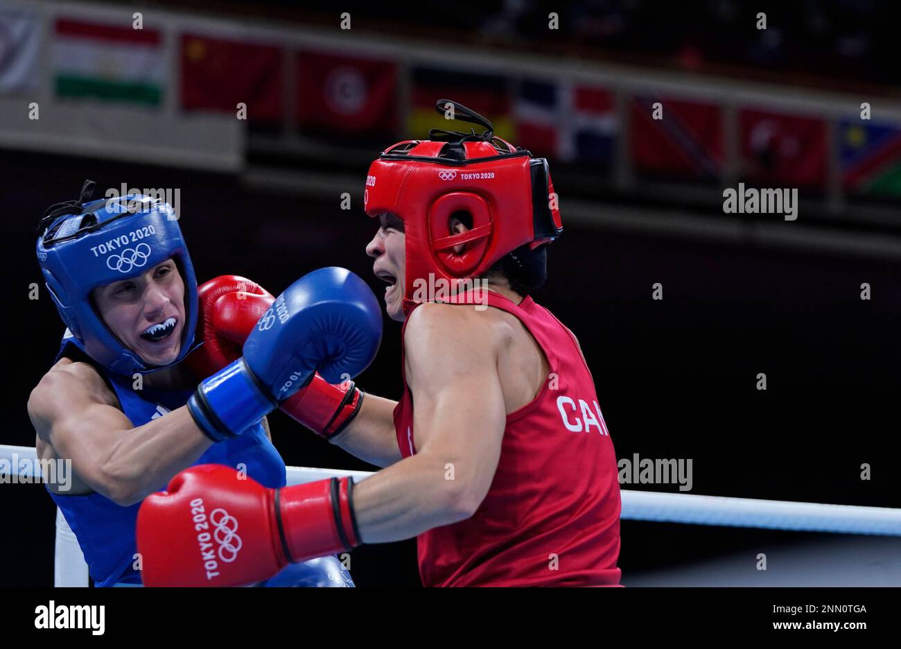 Italy's Irma Testa, in blue, exchange punches with Canada's Caroline ...