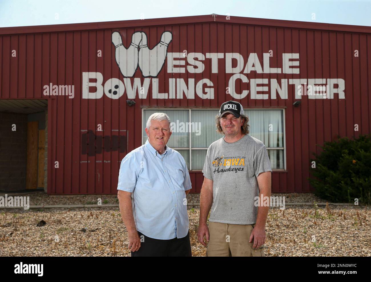 Craig, left, and his son Brett McCormick pose for a photo in front of ...