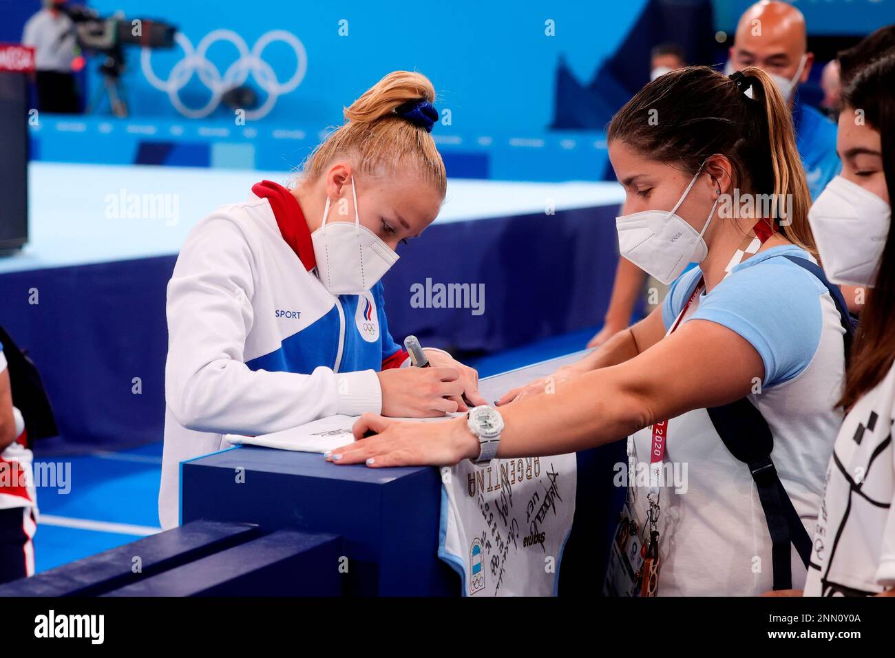 TOKYO, JAPAN - JULY 27: Angelina Melnikova of Team ROC signs a jersey ...
