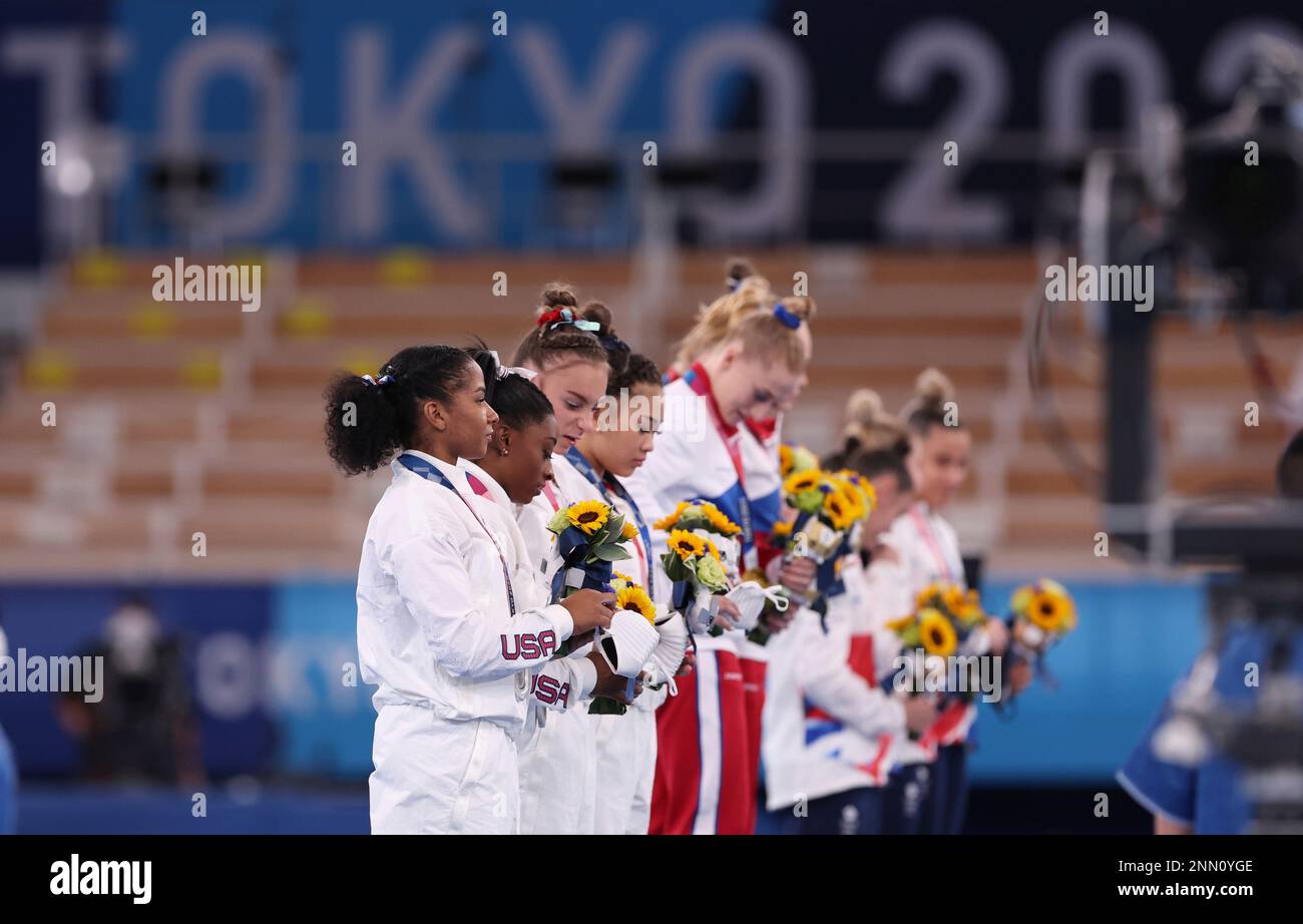 United States' players (L) attend an award ceremony after finnishing ...