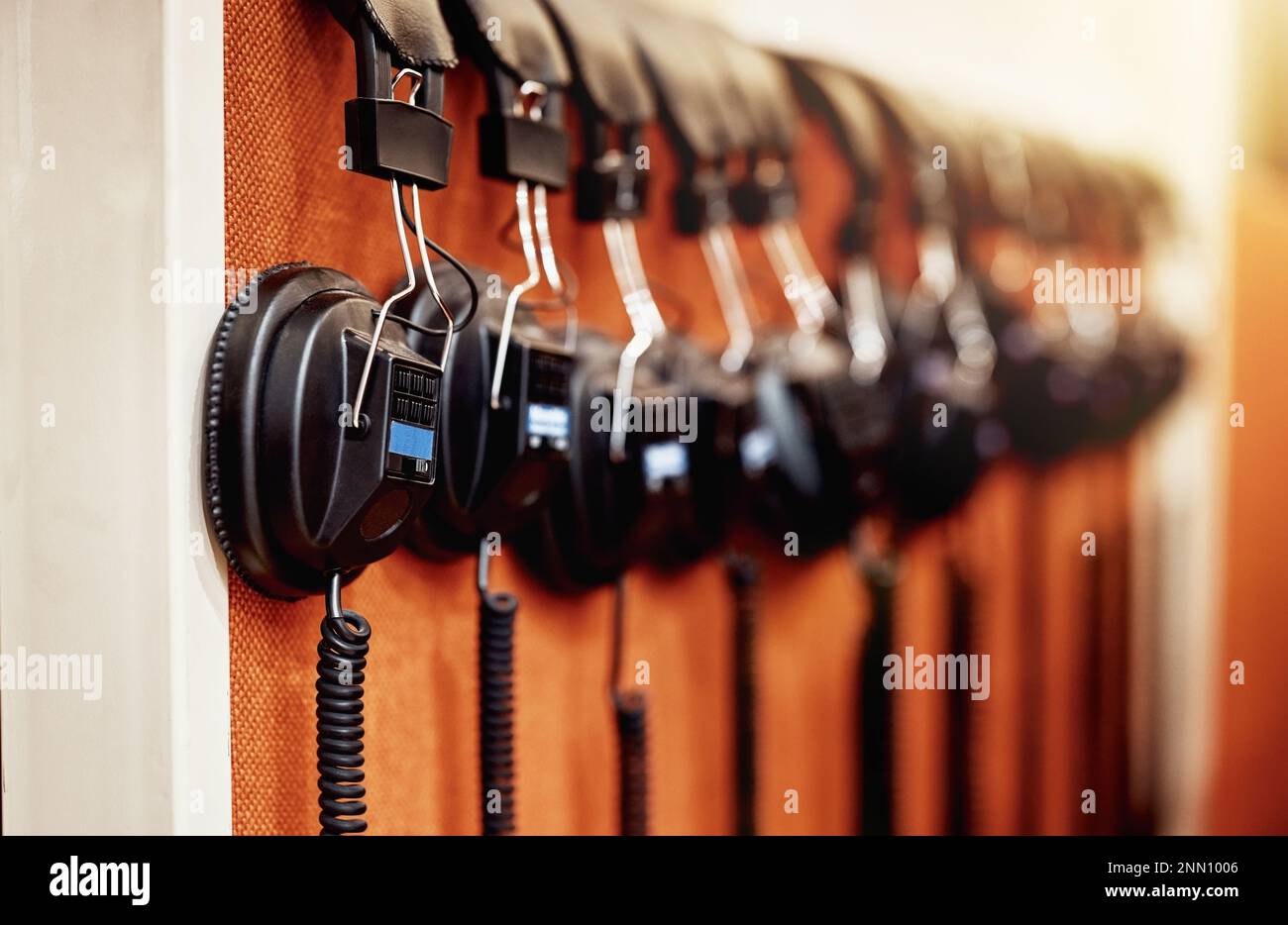Music, equipment and headphones on display at a studio for production ...