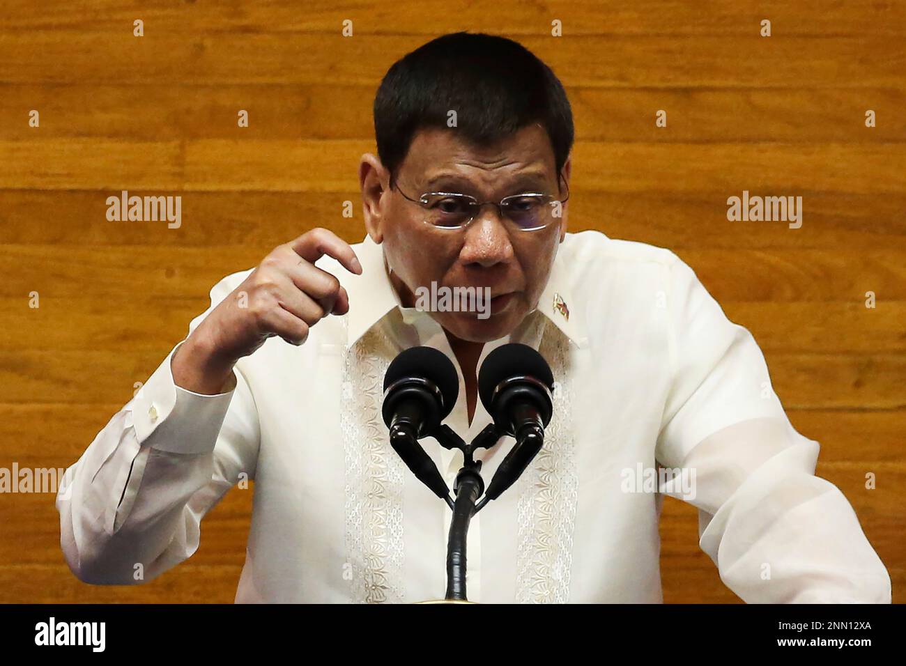 Philippine President Rodrigo Duterte gestures as he delivers his final ...