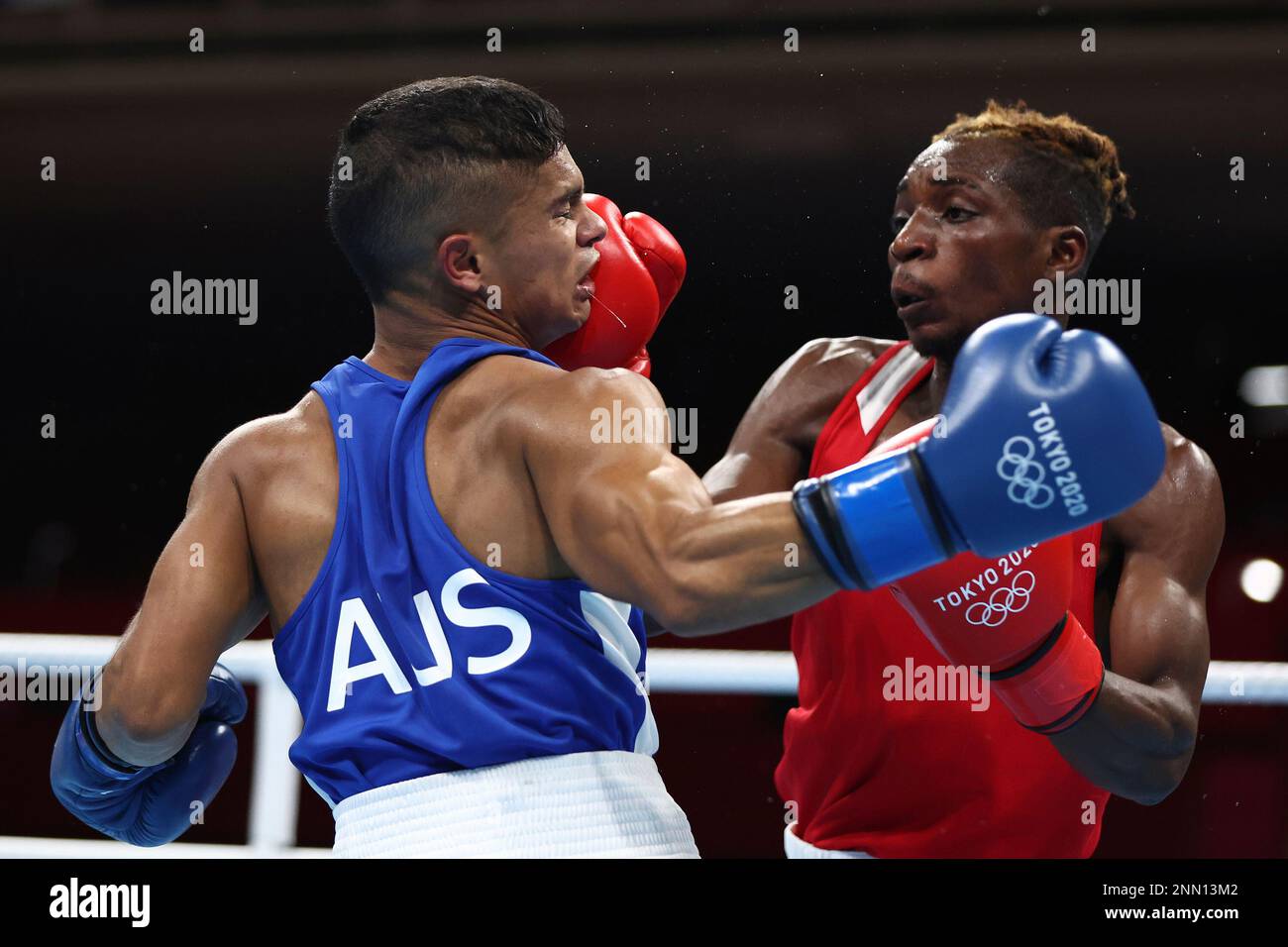 Zambia's Chinyemba, right, punches Australia's Winwood at the 2020 ...