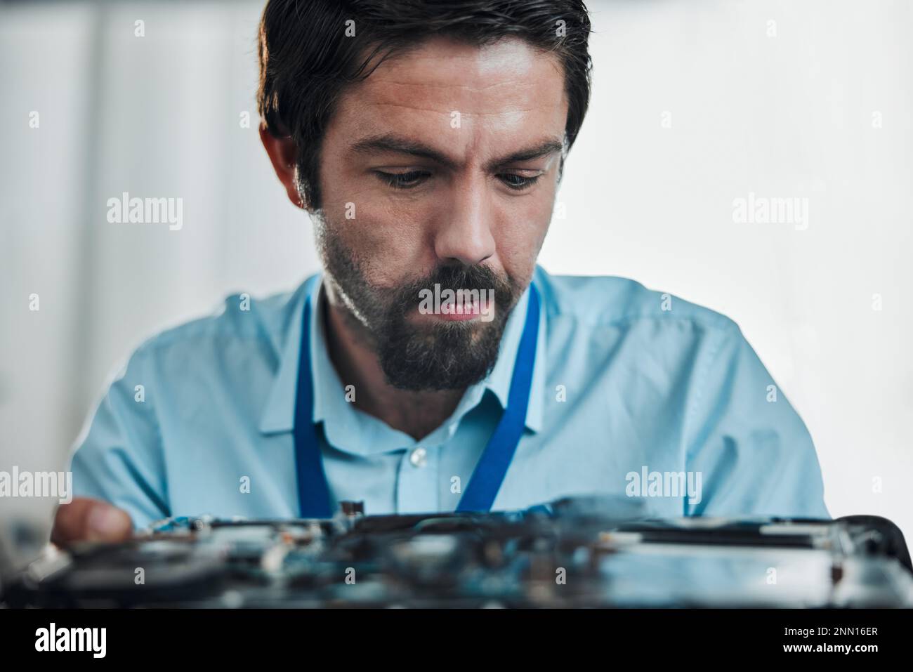 Information technology face, laptop circuit or man repair motherboard ...