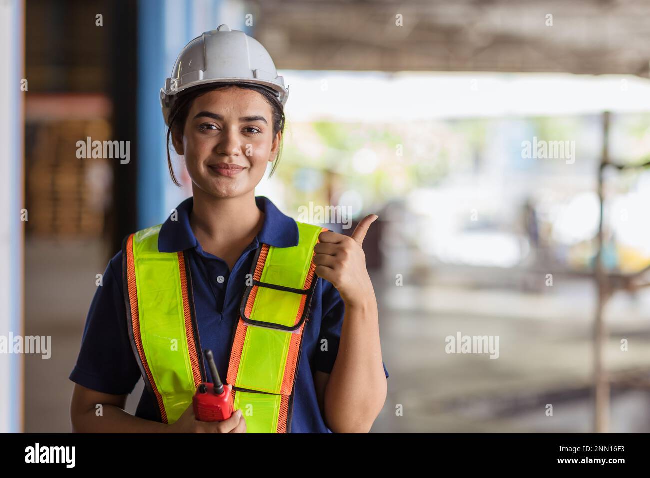 Indian woman staff worker engineer supervisor in safety suit work in ...
