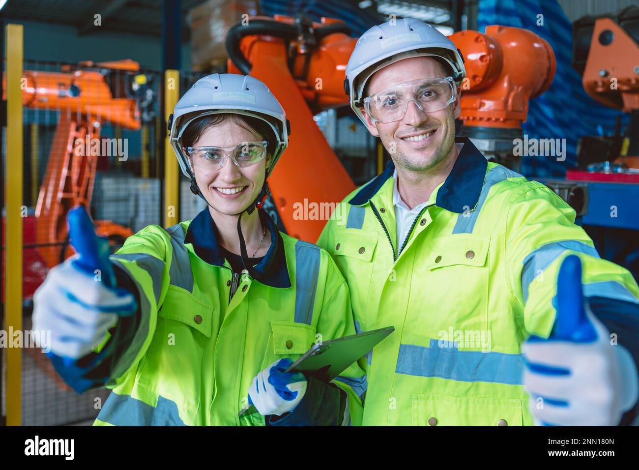 happy engineer team portrait thumbs up enjoy working together in modern ...