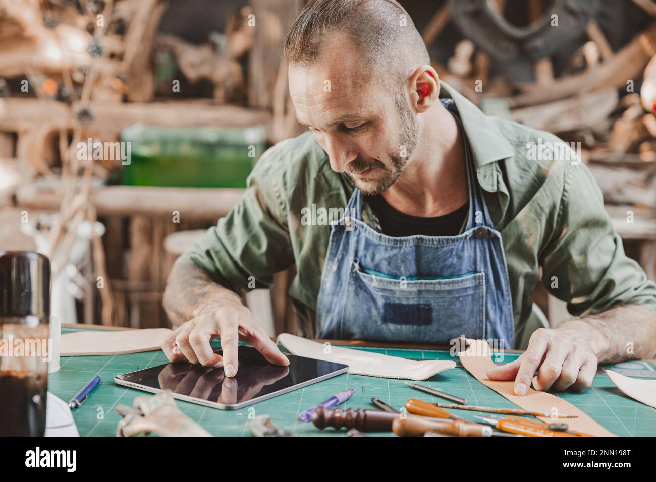 modern artist using tablet computer for helping design sale product and ...