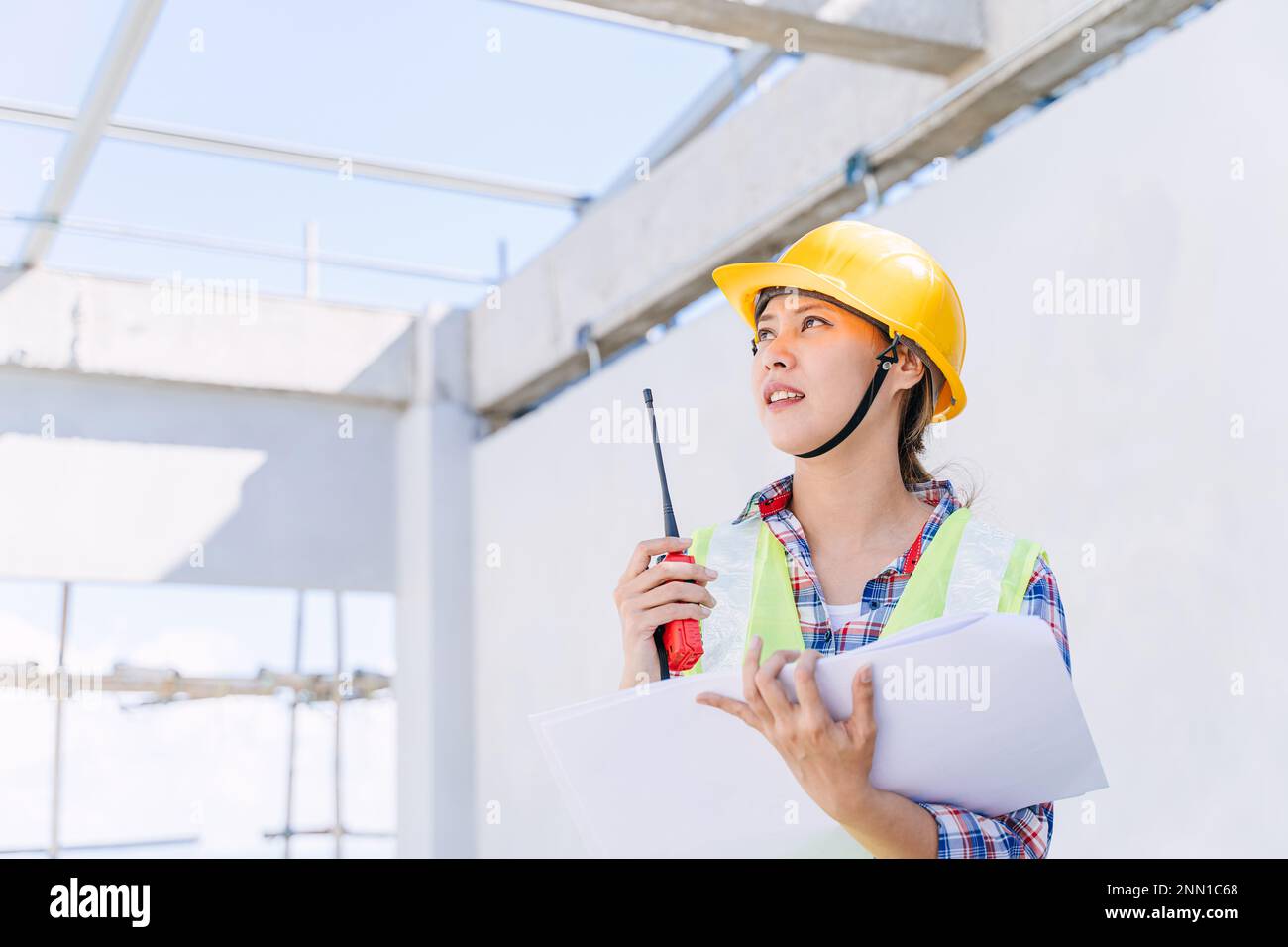 Asian woman engineer worker work in construction site. Smart builder ...