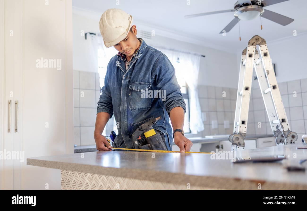 Construction, measurement and handyman doing home repair, renovation ...