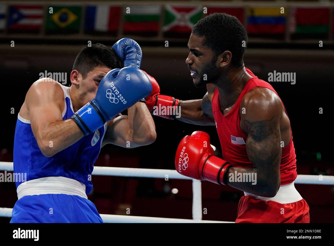 Delante Johnson, of the United States, right, exchanges punches with ...