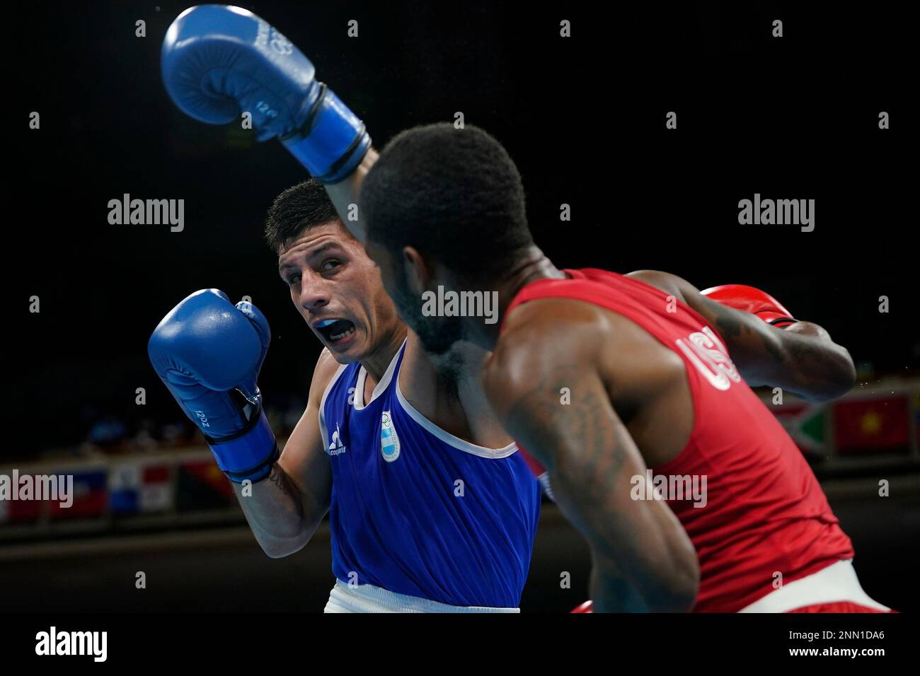 Delante Johnson, of the United States, right, exchanges punches with ...