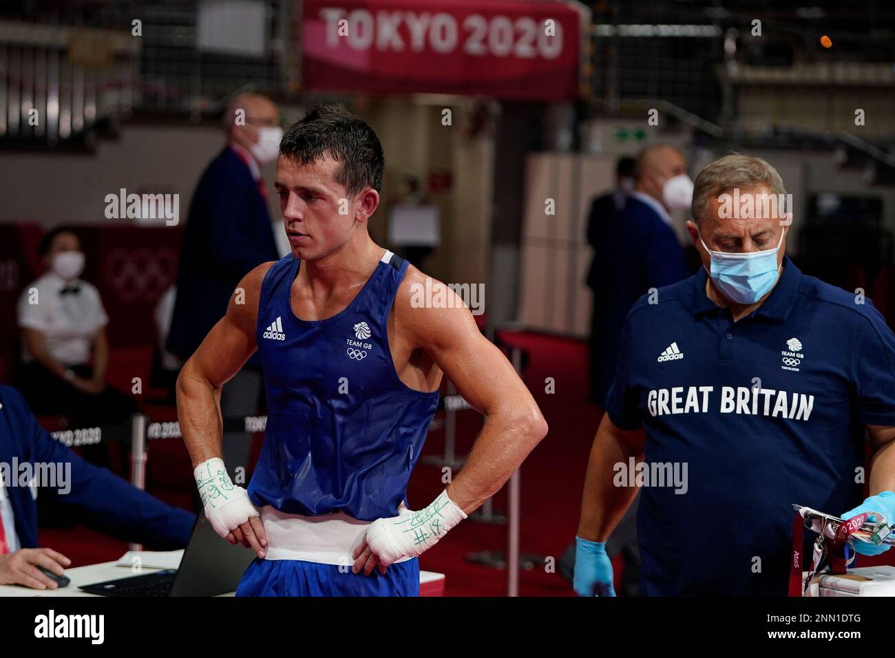 Britain's Peter McGrail, left, after his men's featherweight 57-kg ...