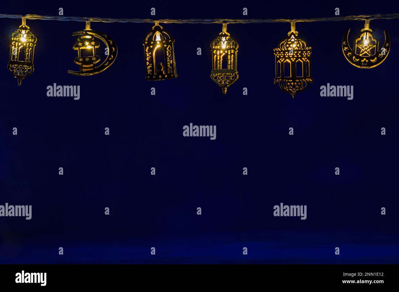 Ramadan decorated lights hanging on dark blue background for the Muslim ...