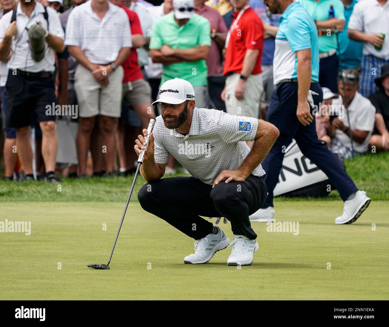 BLAINE, MN - JULY 23: Dustin Johnson lines up his putt at the 7th green ...