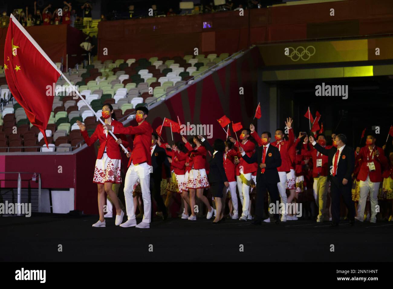 Zhu Ting and Zhao Shuai, of China, carry their country's flag during ...