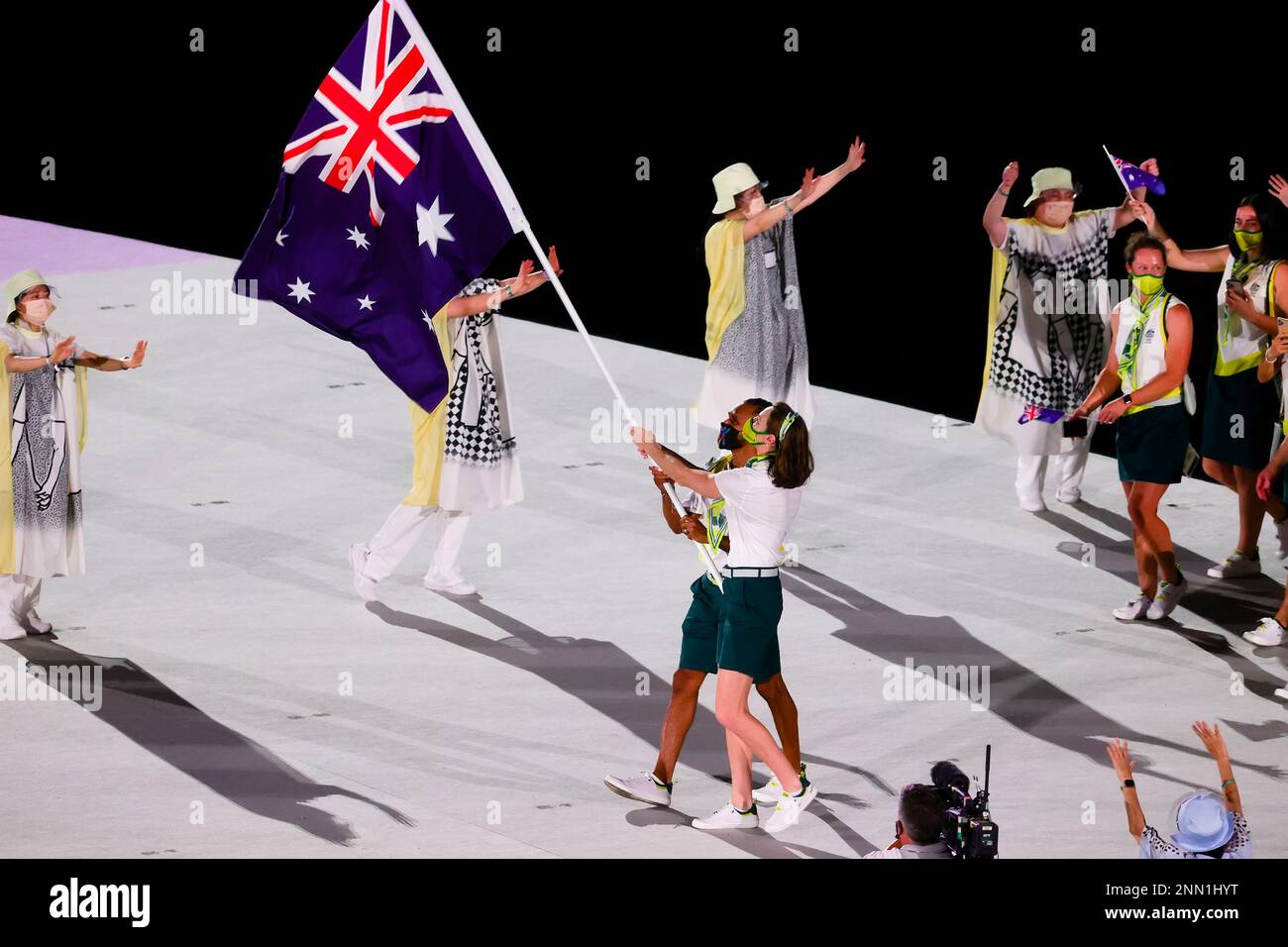 TOKYO, JAPAN - JULY 23: Australia enter the arena with flag bearers ...