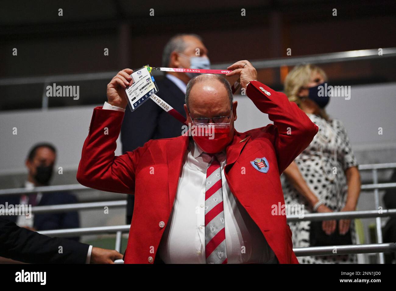 U.S. Prince Albert II of Monaco takes off his ID as he arrives during ...