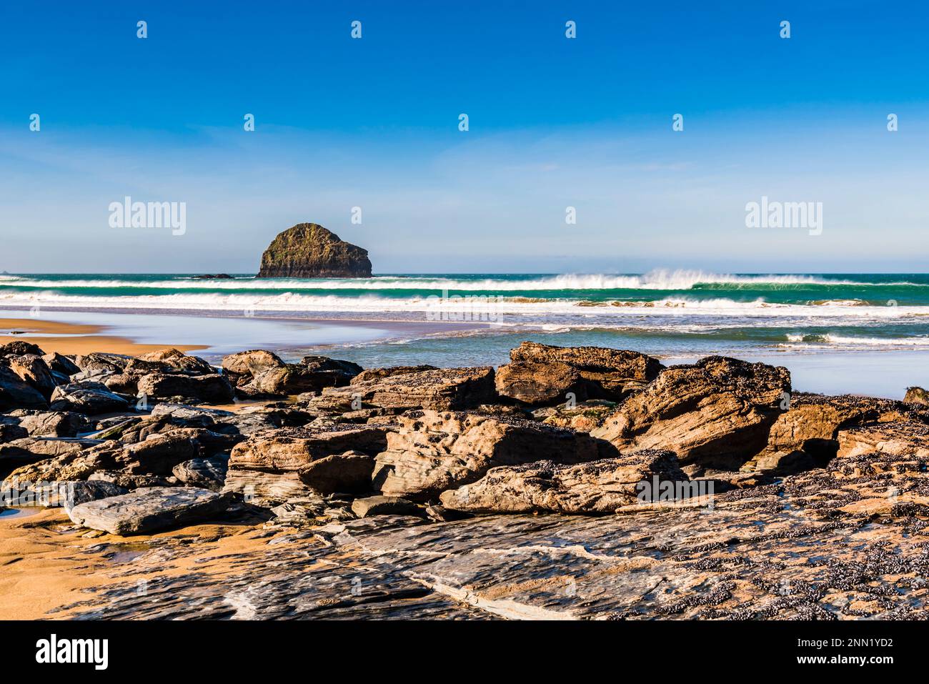 Gull Rock and waves on a clear winter's day at Trebarwith Strand ...