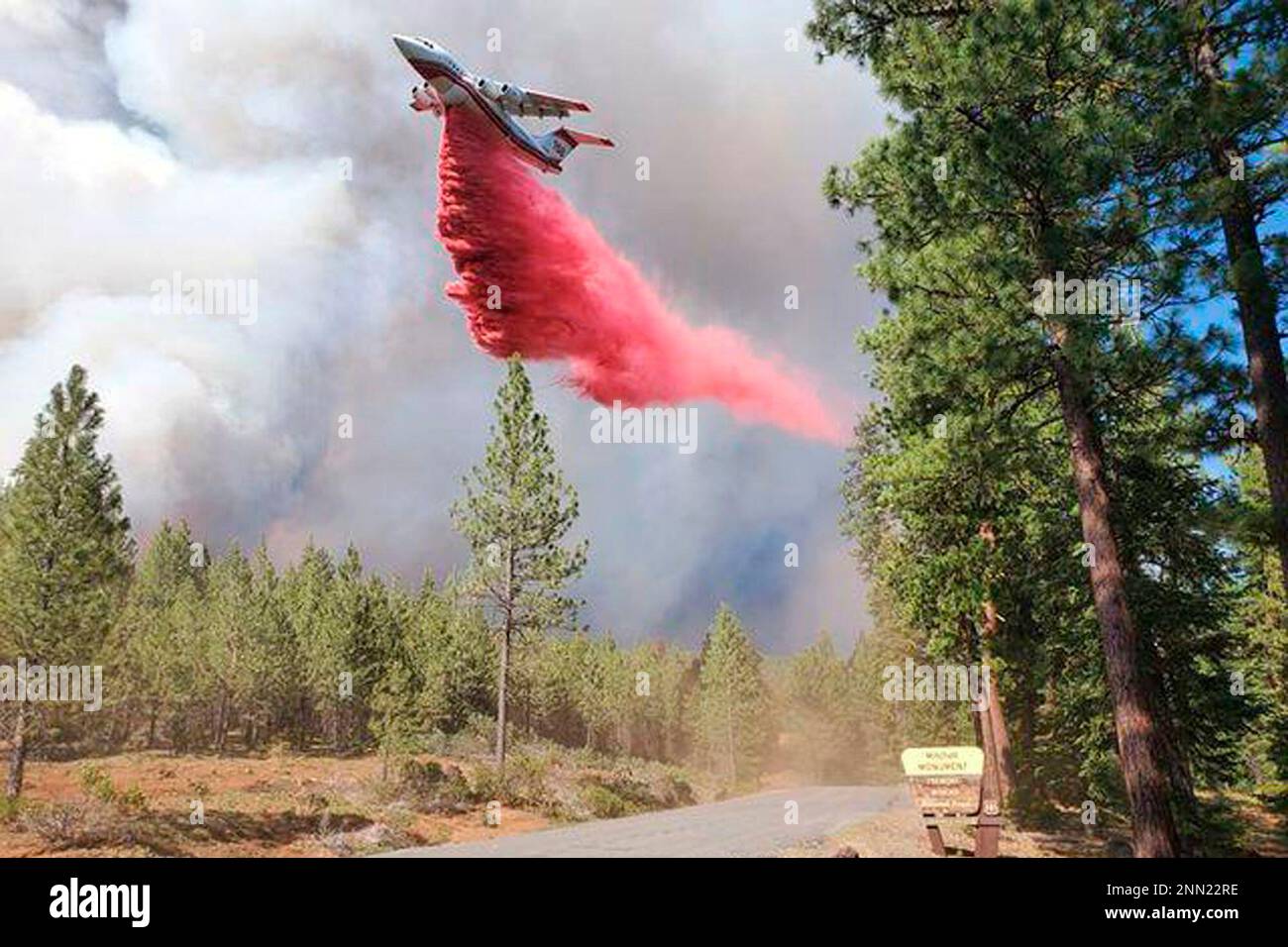 In this photo provided by the Bootleg Fire Incident Command, a tanker ...