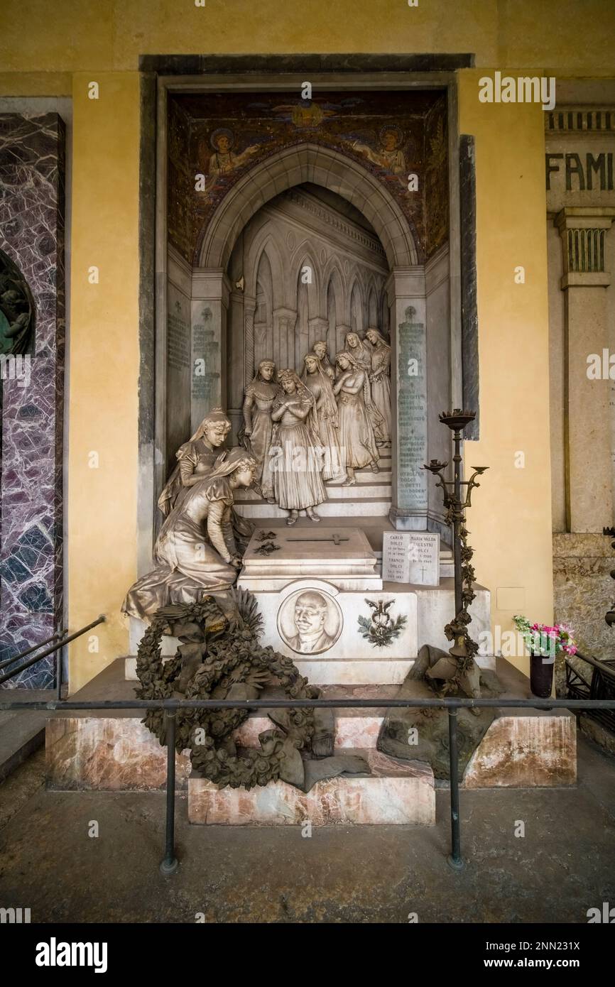 Artfully designed tomb with statues of mourning women at the Cimitero ...