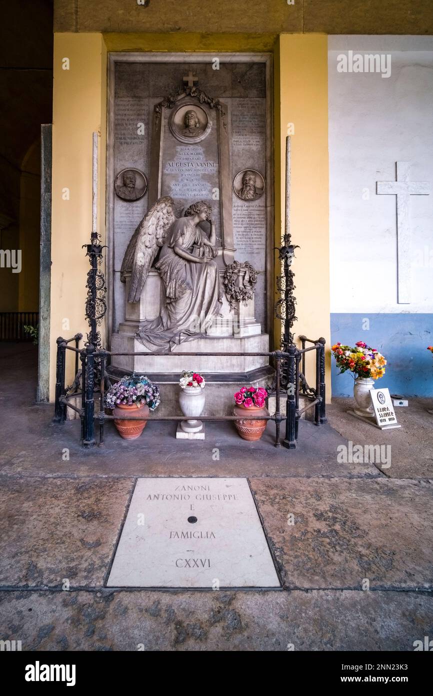 Artfully designed tomb with the statue of an angel at the Cimitero ...
