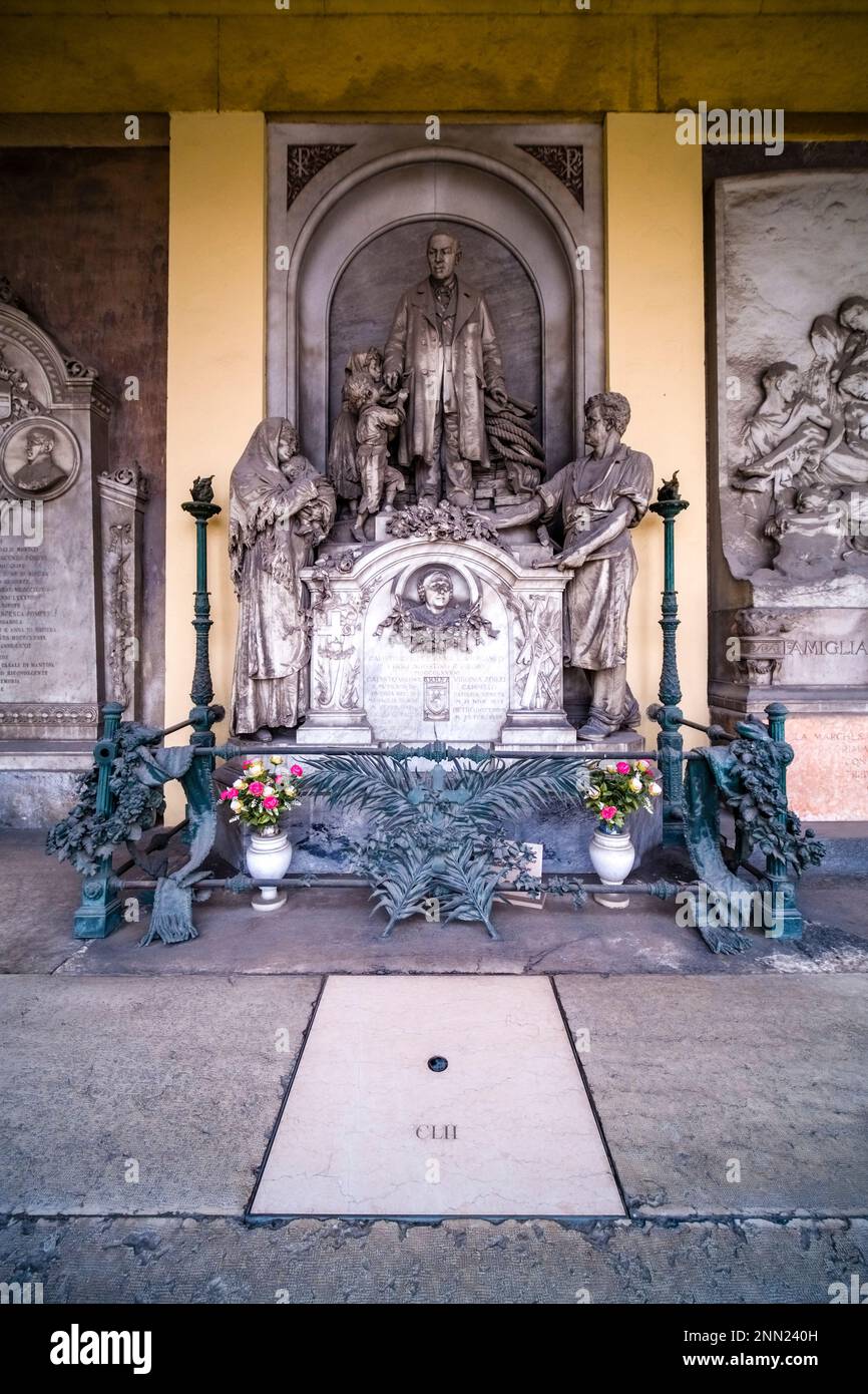 Artfully designed tomb with statues of mourning people at the Cimitero ...