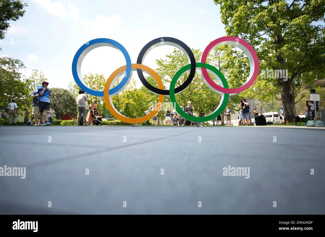 People pose with the Olympic Five-Ring Emblem at Japan Sport Olympic ...