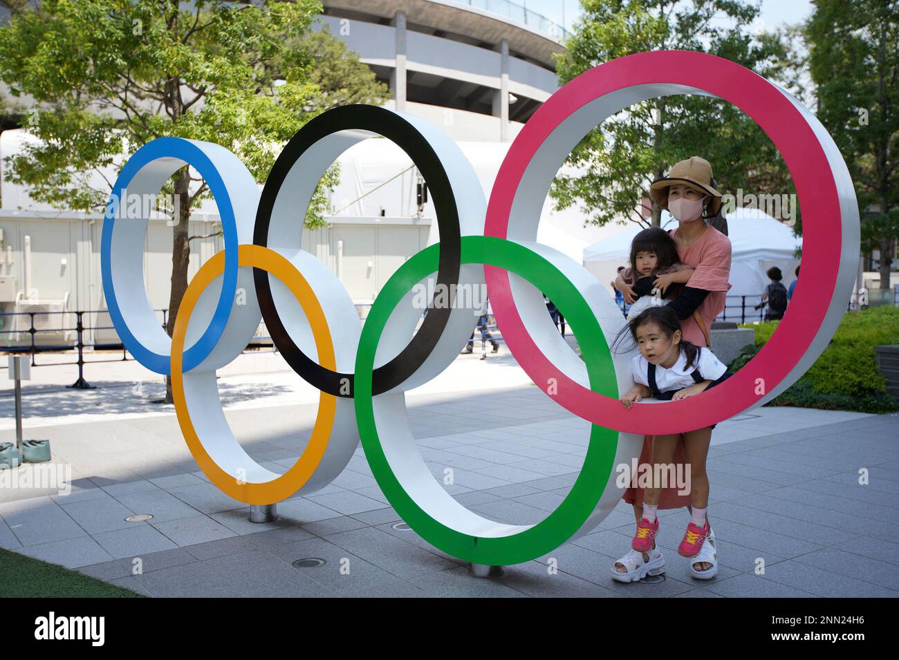 People pose with the Olympic Five-Ring Emblem at Japan Sport Olympic ...
