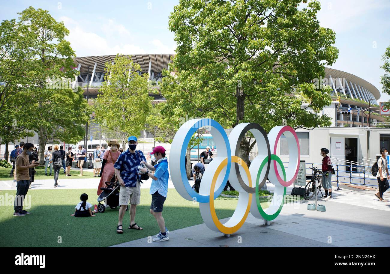 People pose with the Olympic Five-Ring Emblem at Japan Sport Olympic ...